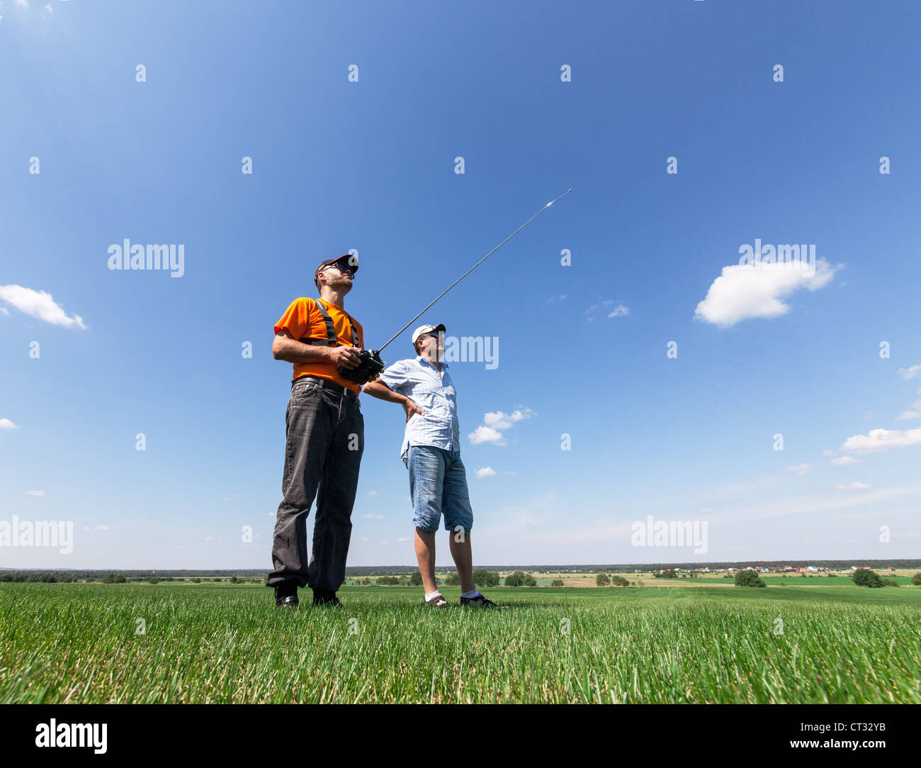 Two Man controls RC gliders in the sky Stock Photo - Alamy