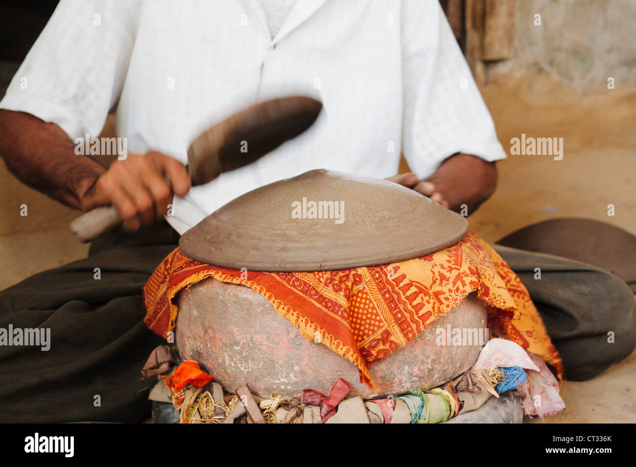 Local potter making earthen ware pots for food storage and cooking ...