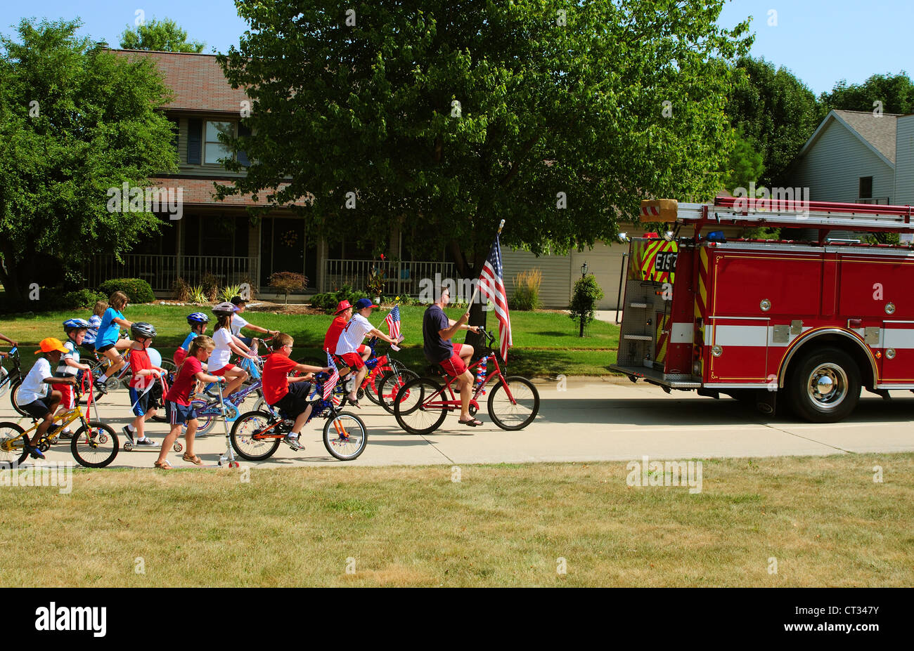 4th of July or Independence Day parade in the USA. The local fire ...