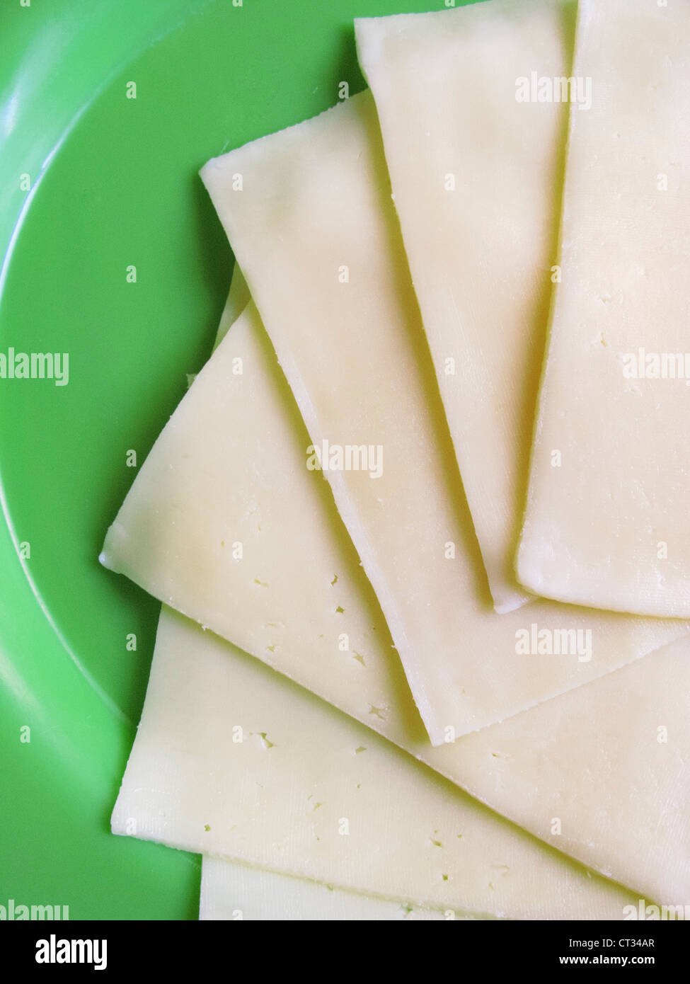 Slices of Gouda Cheese Stock Photo - Alamy