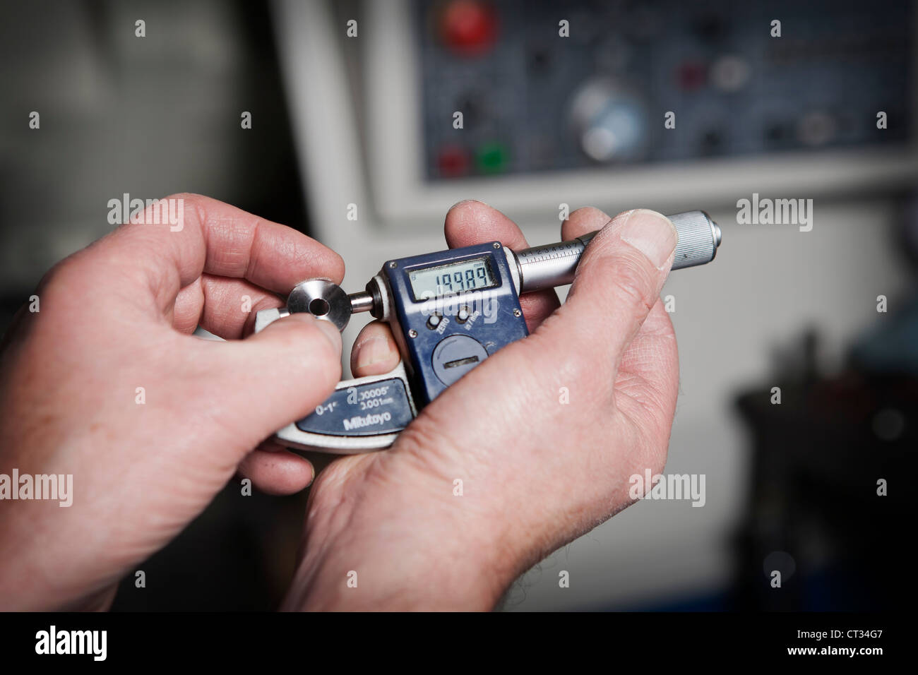 Hands Holding Digital Micrometer Stock Photo - Alamy