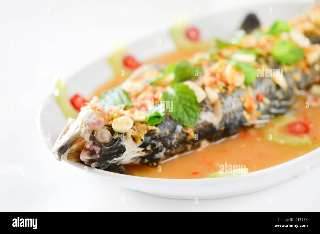 Steamed snapper fish with chili and lemon , spicy food Stock Photo - Alamy