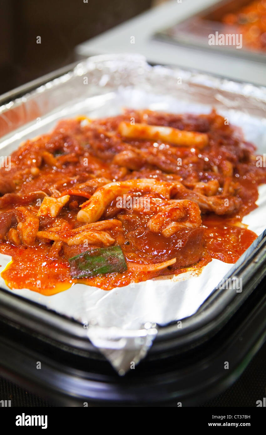 A close up of a Korean side dish called tokpoki on display at a store ...