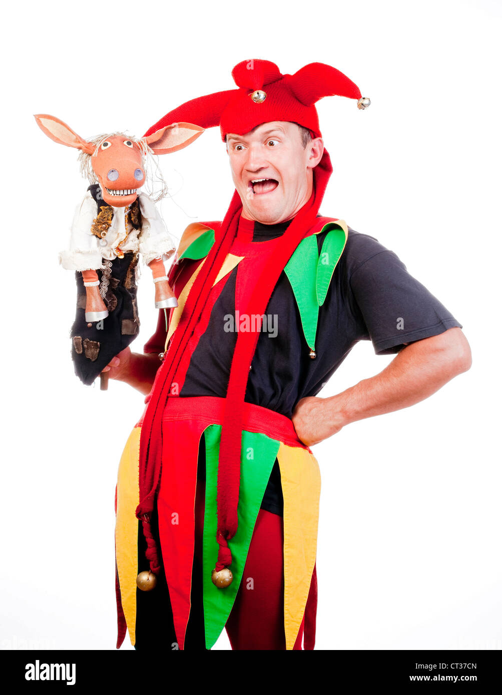 jester - entertaining figure in typical costume with puppet Stock Photo ...