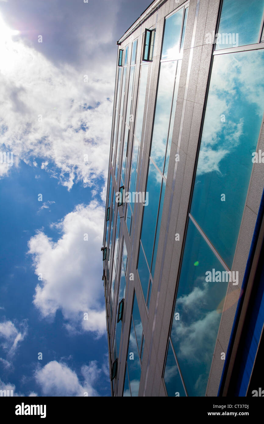 A different perspective of looking up at a building against the blue ...