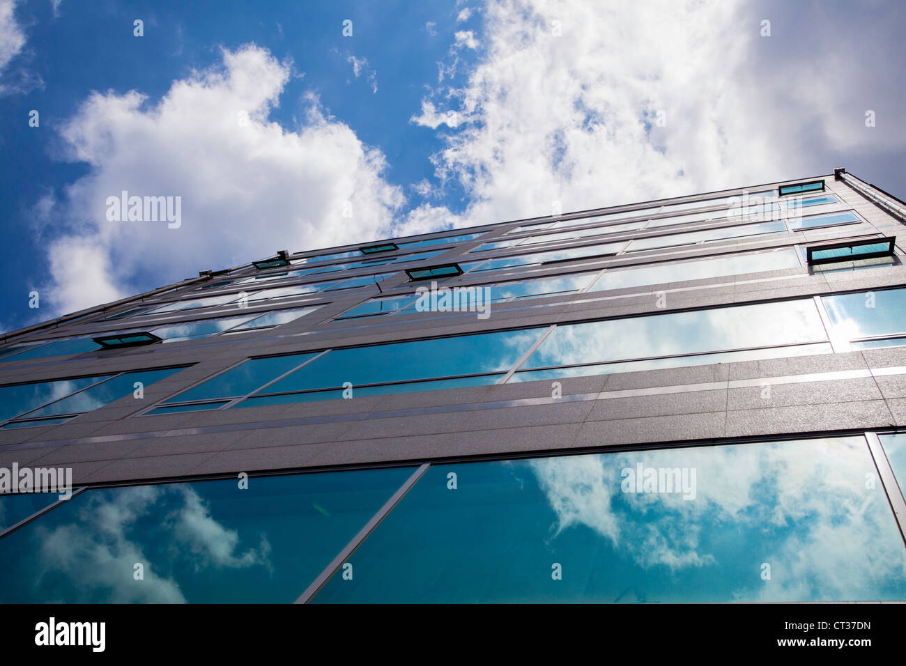 A different perspective of looking up at a building against the blue ...