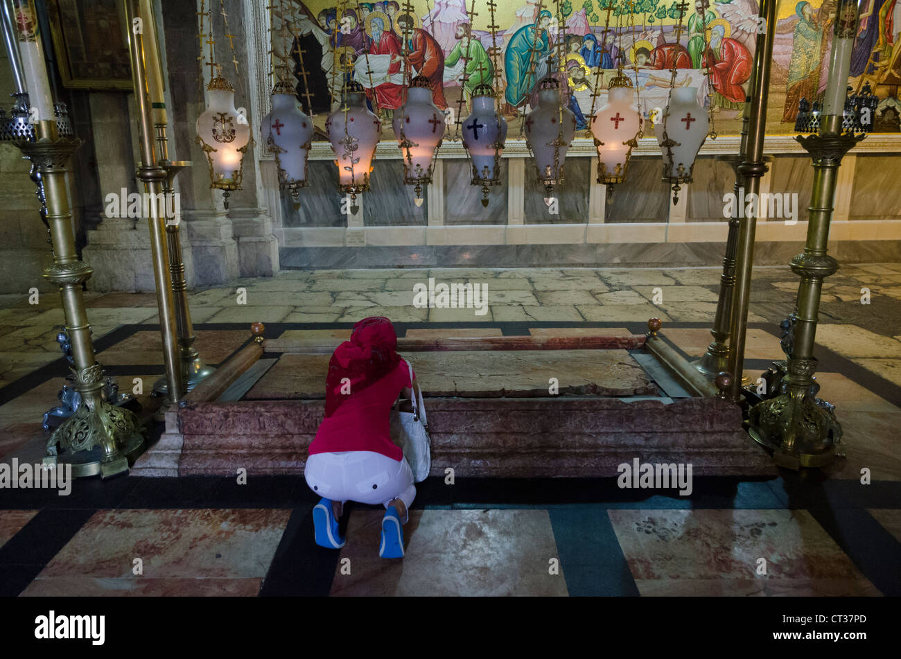 Woman prostrating at the Stone of Anointing. Holy Sepulcher. Jerusalem ...