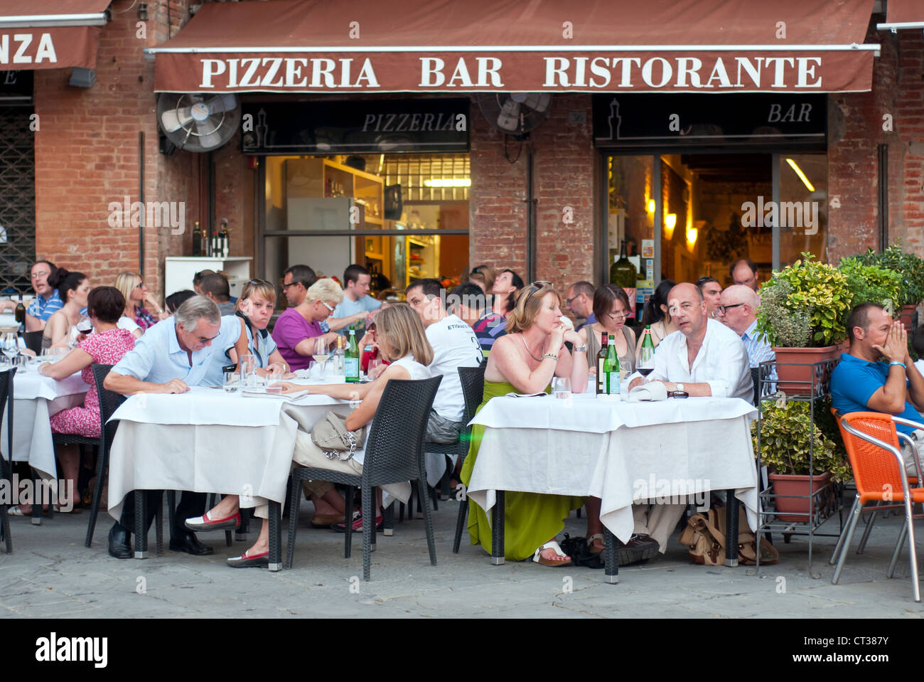 People Eating Out at Outdoor Restaurant at Pizza del Campo, Siena ...