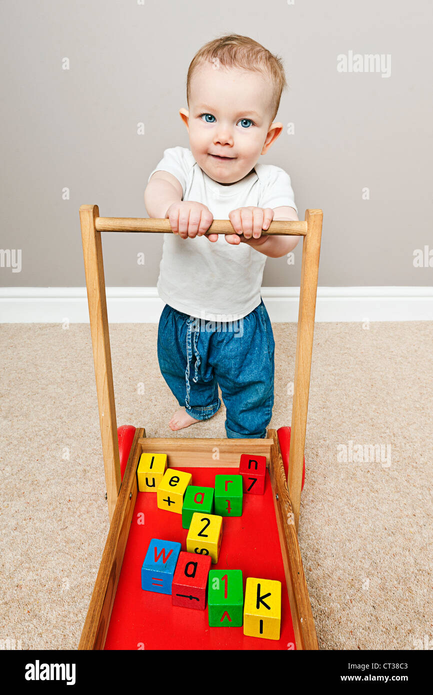 Baby Learning to Walk Stock Photo - Alamy