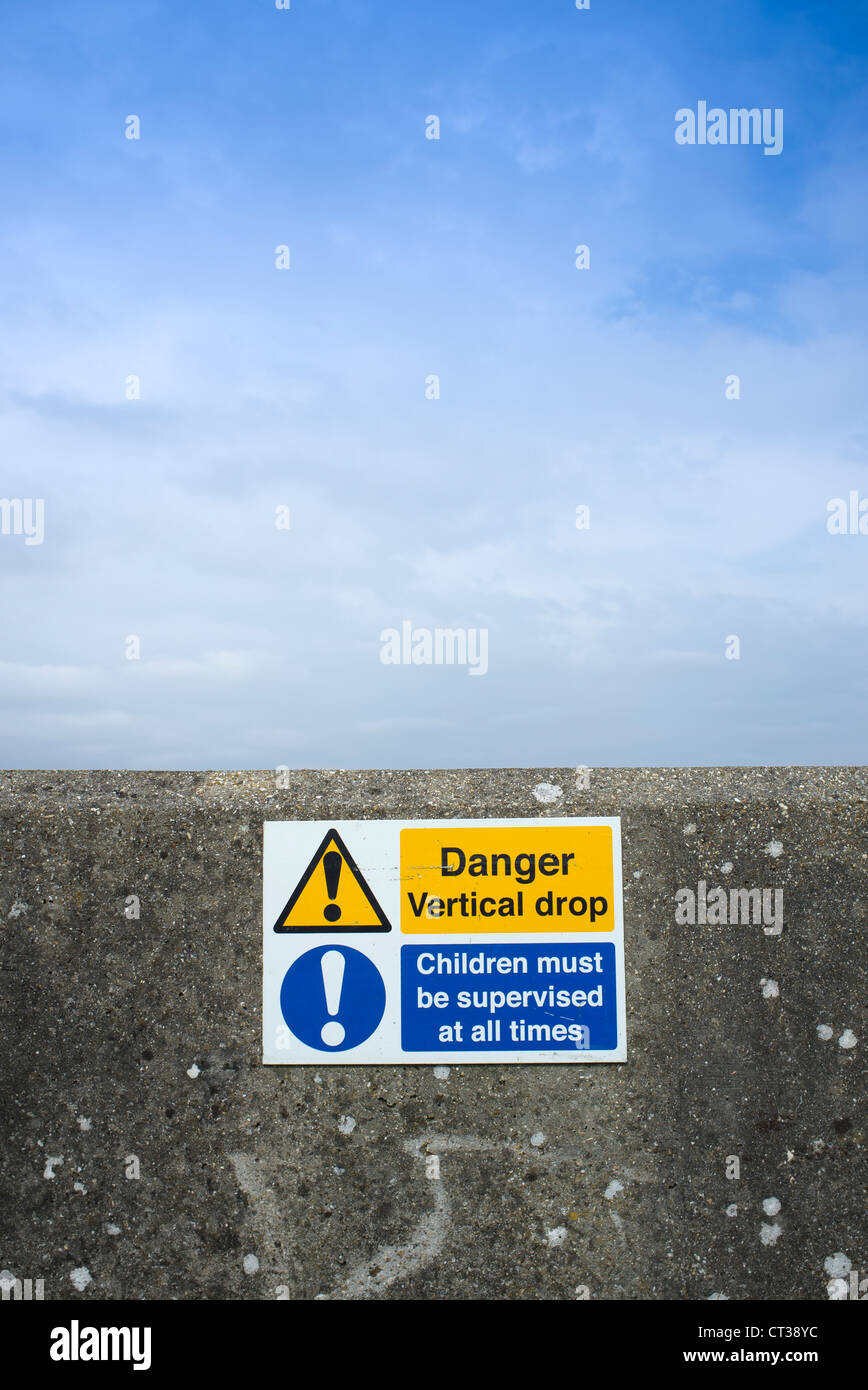 danger vertical drop warning sign Stock Photo - Alamy