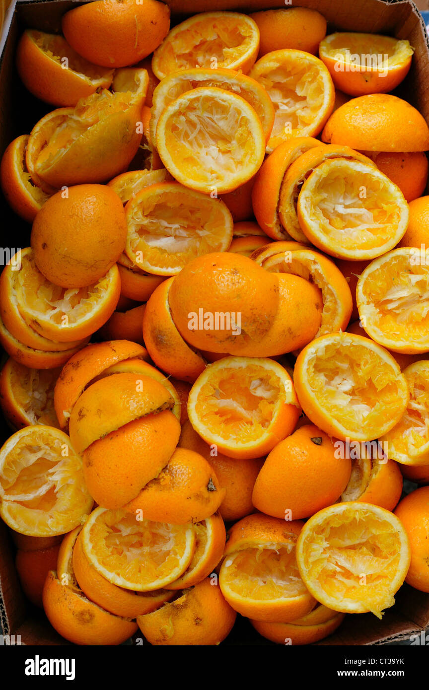 Squeezed oranges in a box Stock Photo - Alamy