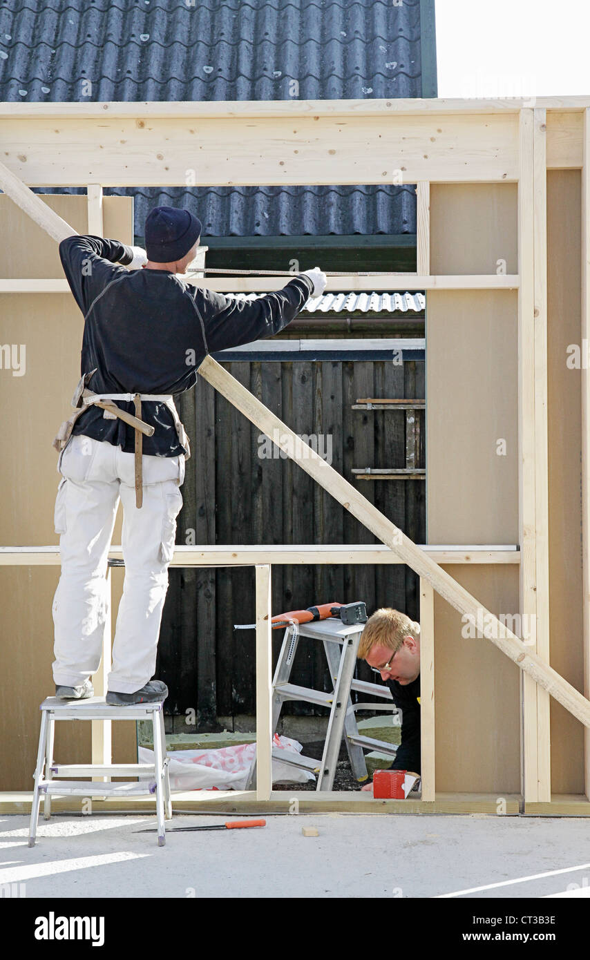 Builders at work on new structure Stock Photo - Alamy