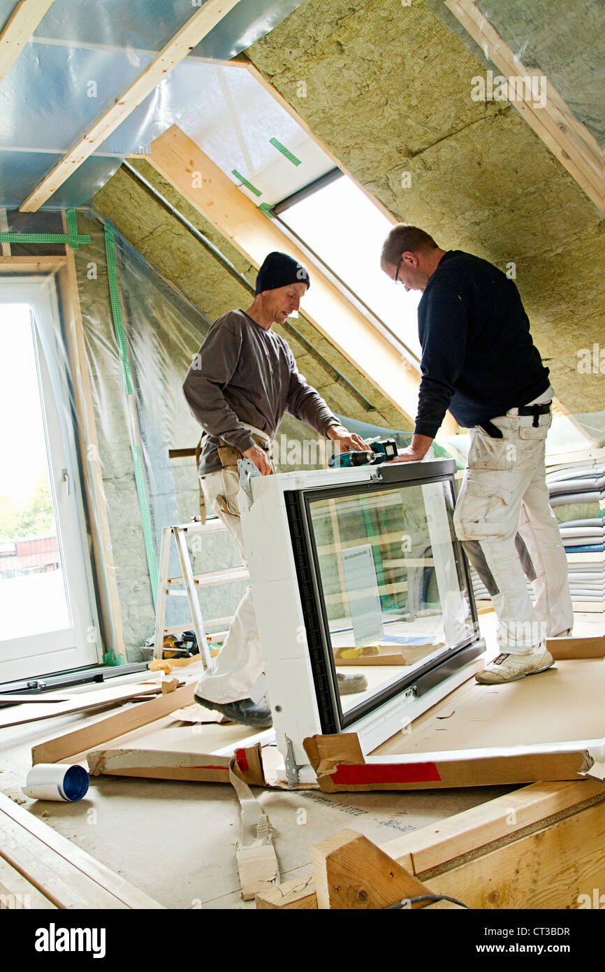 Builders at work on new structure Stock Photo - Alamy