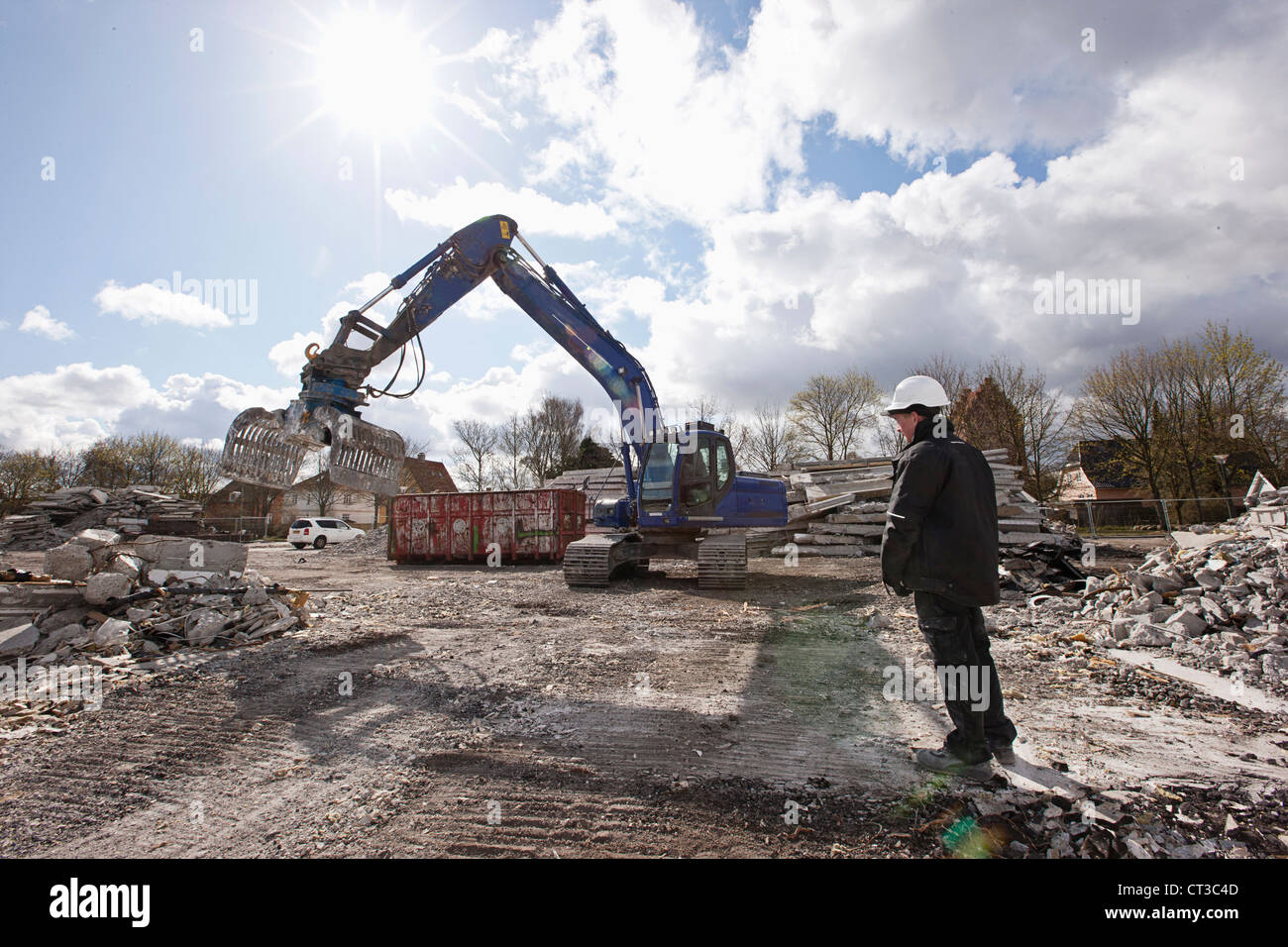 Worker standing on construction site Stock Photo - Alamy
