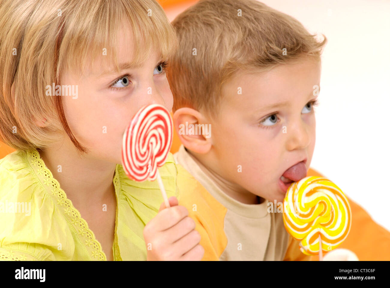CHILD EATING SWEETS Stock Photo - Alamy