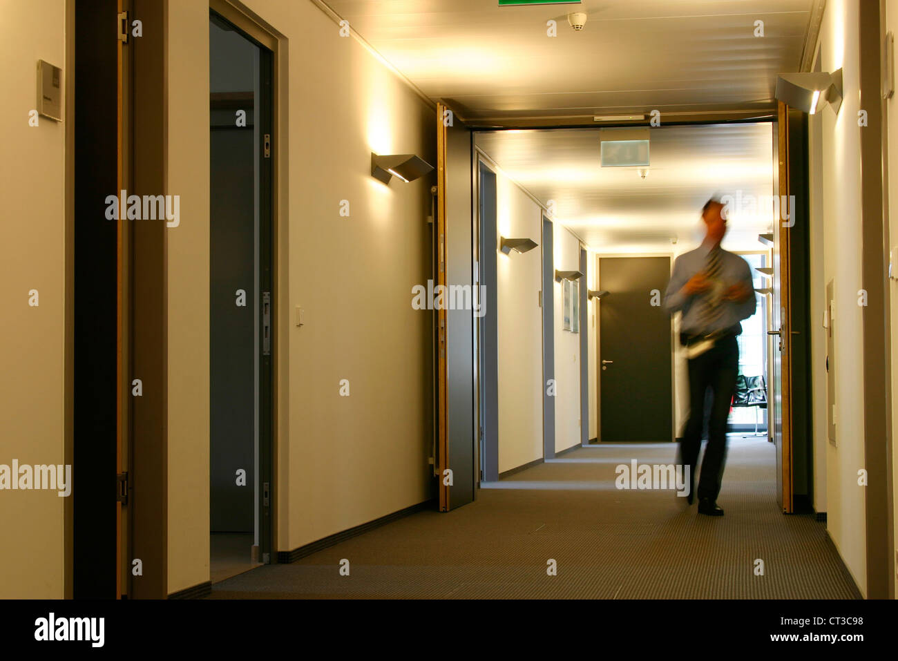 Employee goes through floor in his office Stock Photo - Alamy
