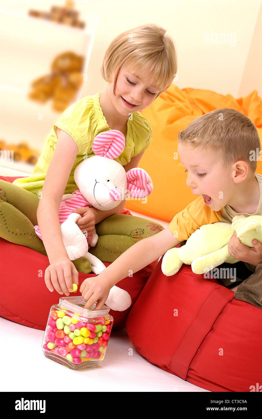 CHILD EATING SWEETS Stock Photo - Alamy