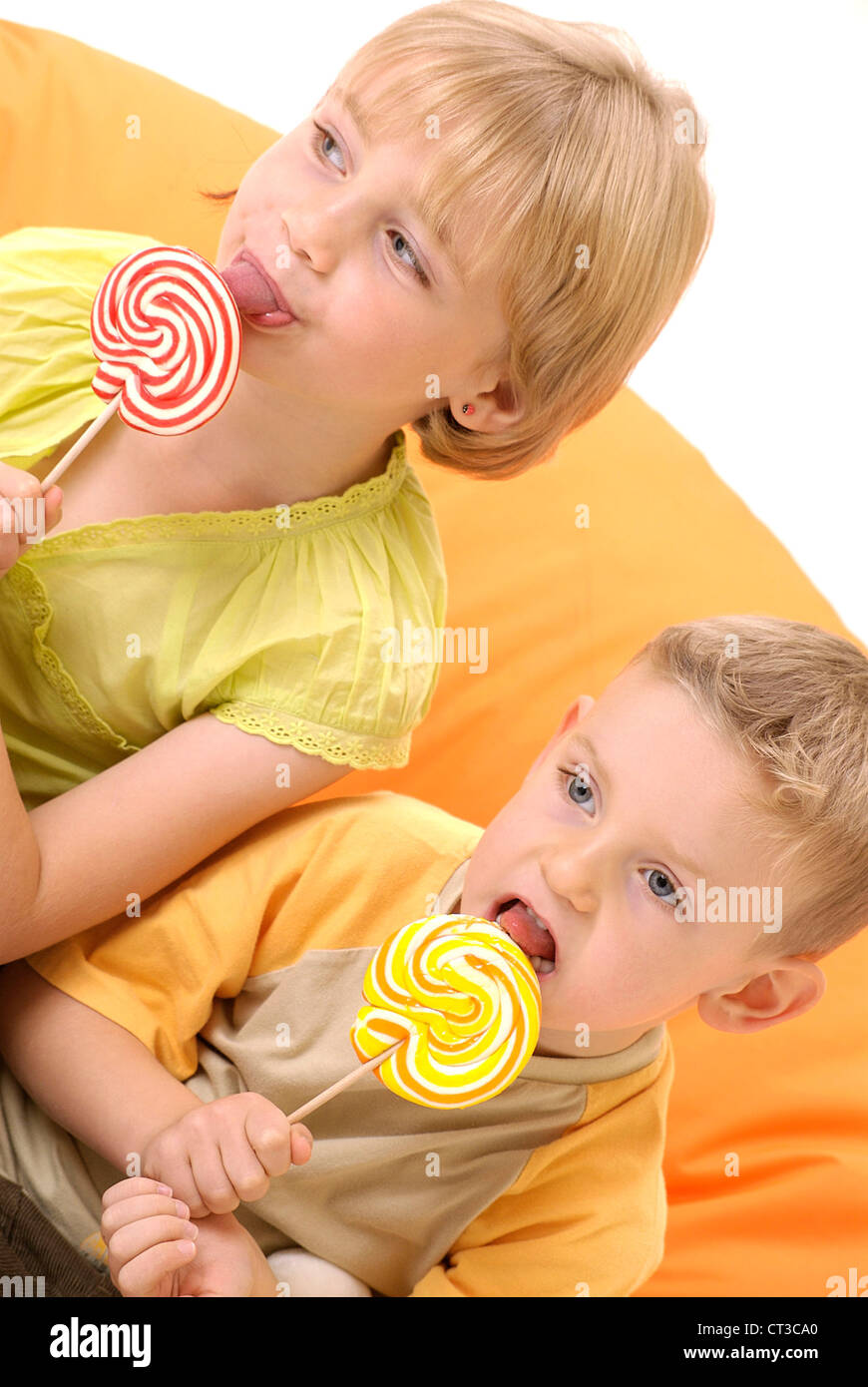 CHILD EATING SWEETS Stock Photo - Alamy
