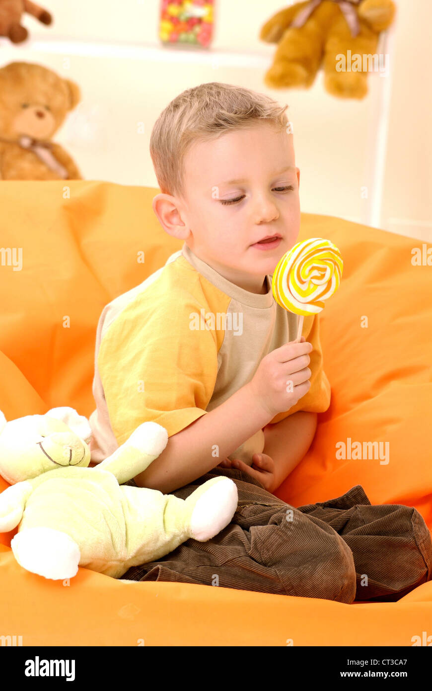 CHILD EATING SWEETS Stock Photo - Alamy