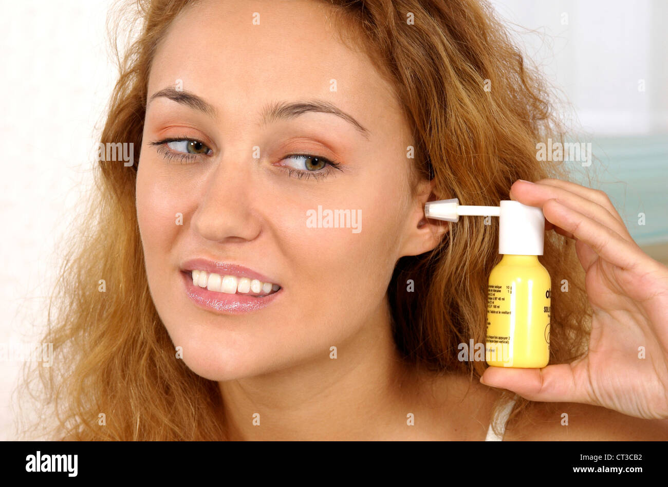 EAR TREATMENT, WOMAN Stock Photo - Alamy