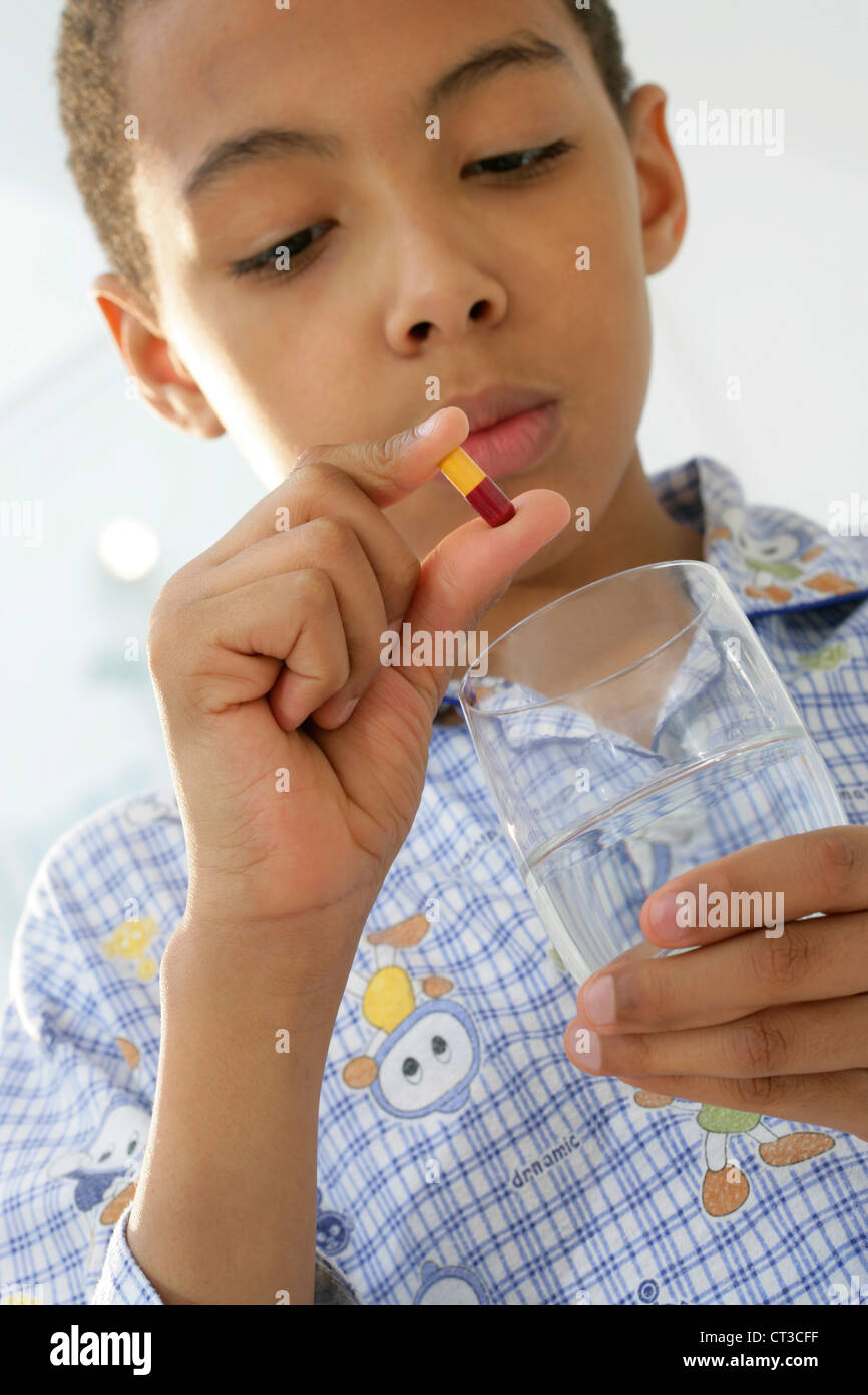 CHILD TAKING MEDICATION Stock Photo - Alamy