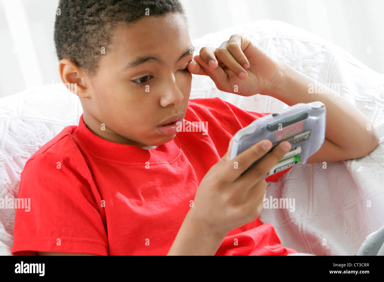 CHILD PLAYING WITH VIDEO GAME Stock Photo - Alamy