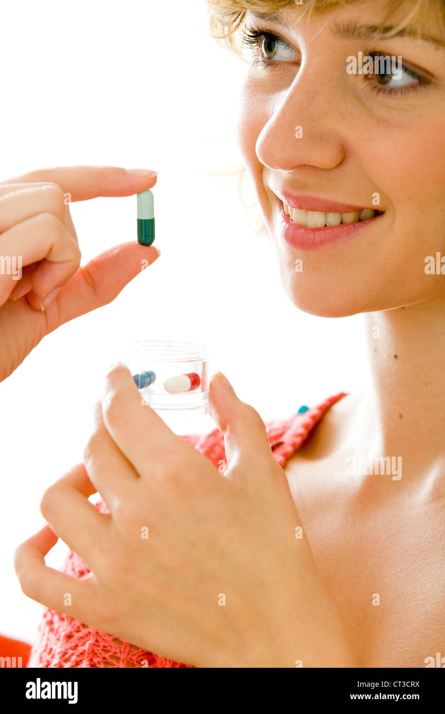 WOMAN TAKING MEDICATION Stock Photo - Alamy