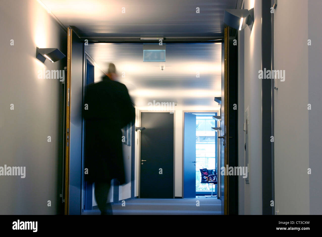 Employee goes through floor in his office Stock Photo - Alamy