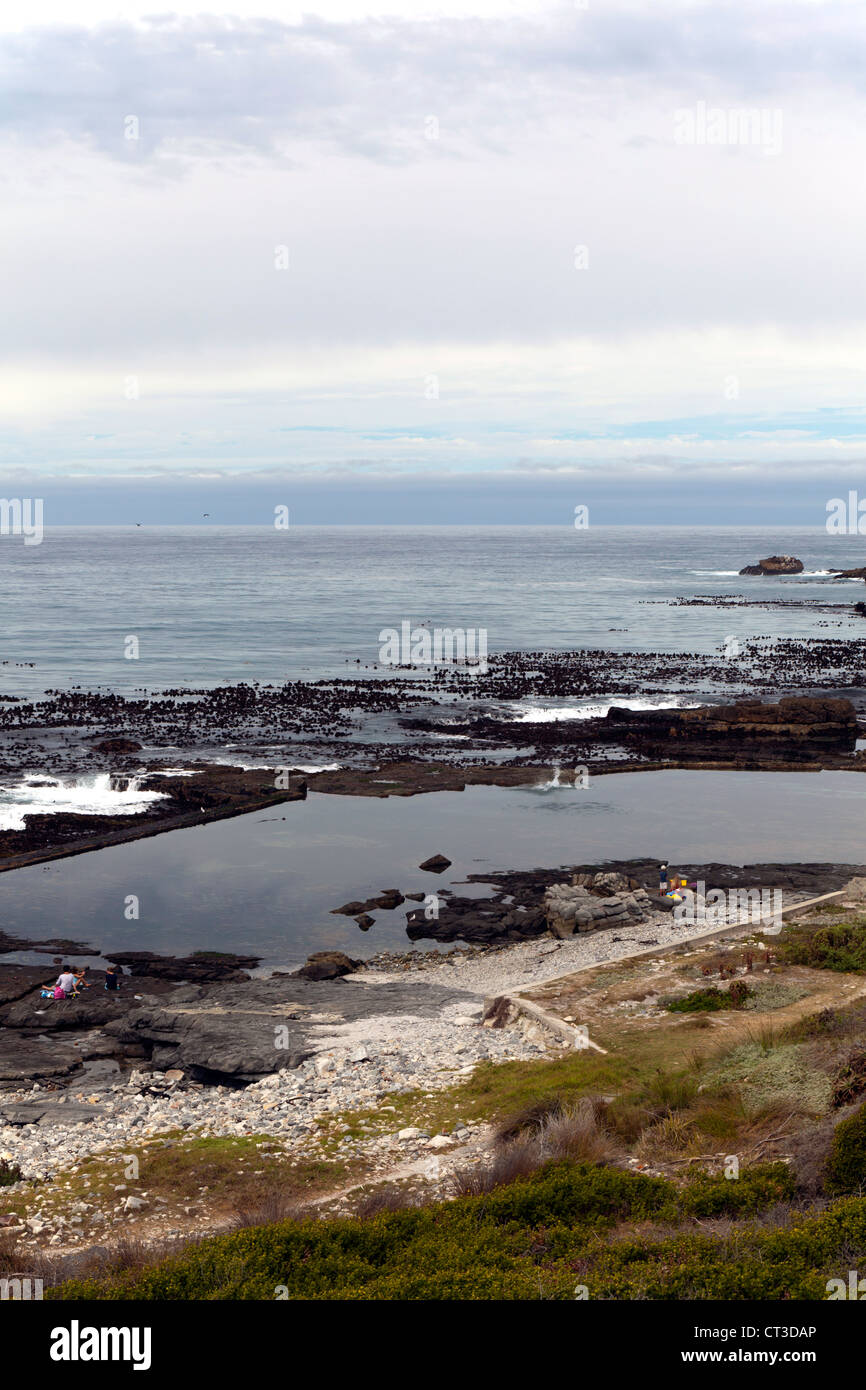 The marine pool and Walker Bay at Hermanus, South Africa Stock Photo ...
