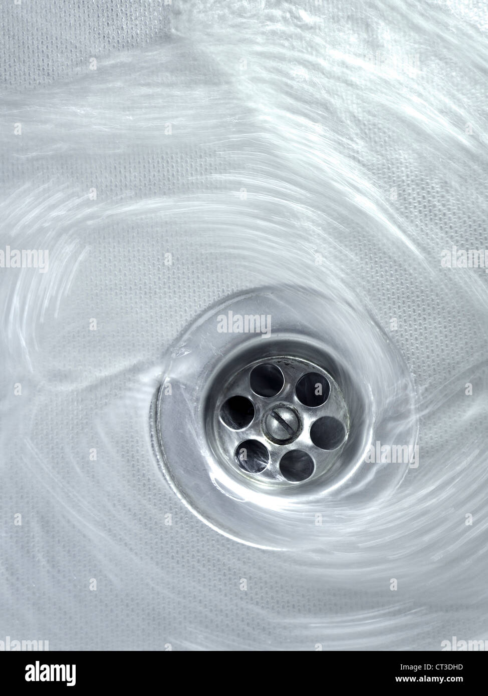water swirl flow to the kitchen drain Stock Photo - Alamy
