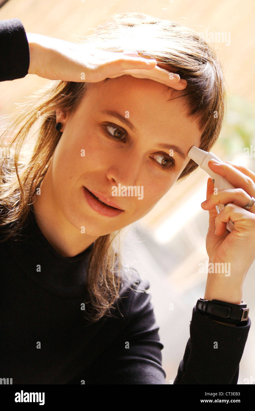 WOMAN WITH FEVER Stock Photo - Alamy