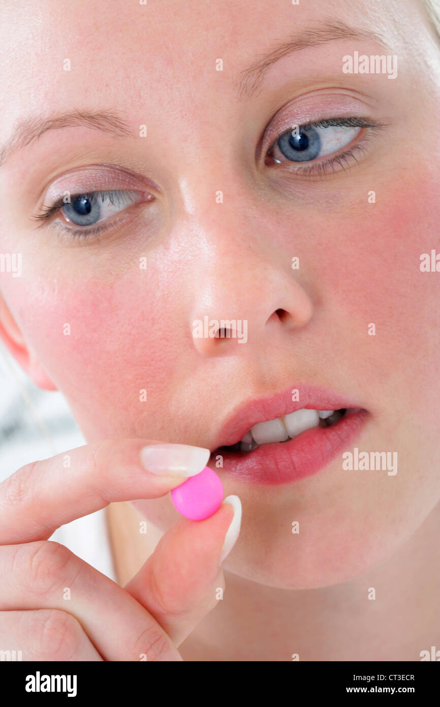 WOMAN TAKING MEDICATION Stock Photo - Alamy