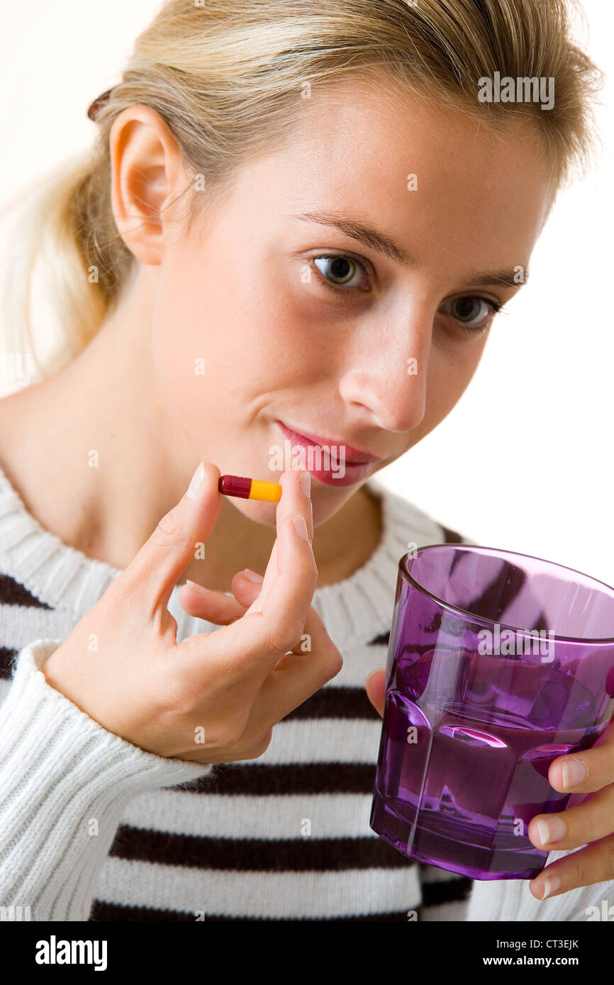 WOMAN TAKING MEDICATION Stock Photo - Alamy