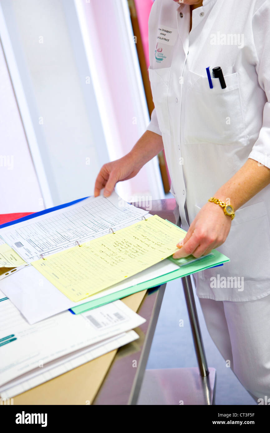 NURSE WITH PATIENT'S RECORD Stock Photo - Alamy