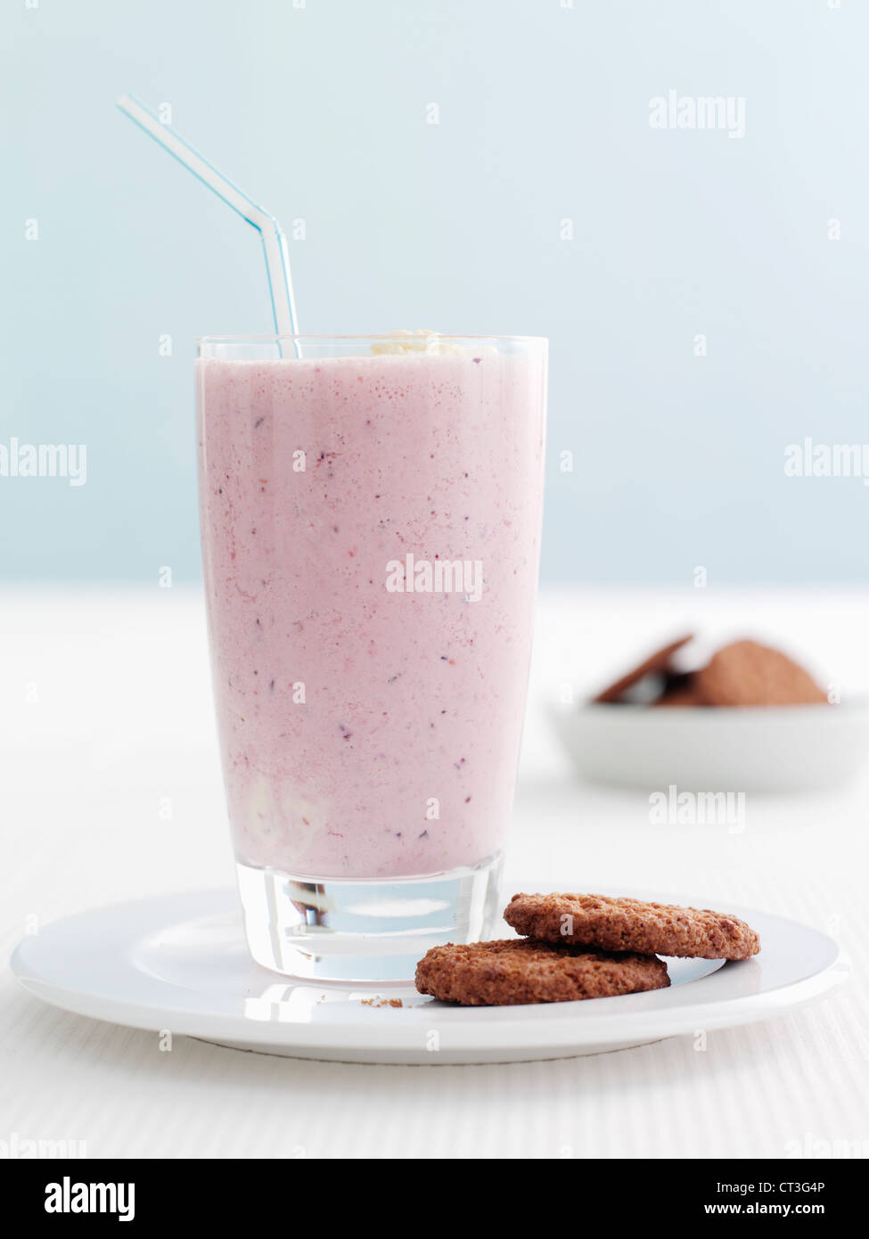 Plate of fruit smoothie and cookies Stock Photo - Alamy