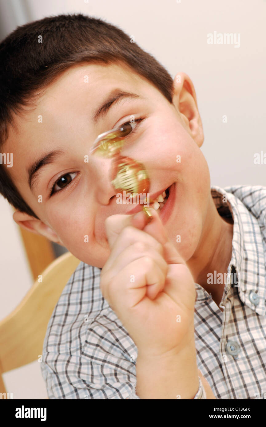 CHILD EATING SWEETS Stock Photo - Alamy