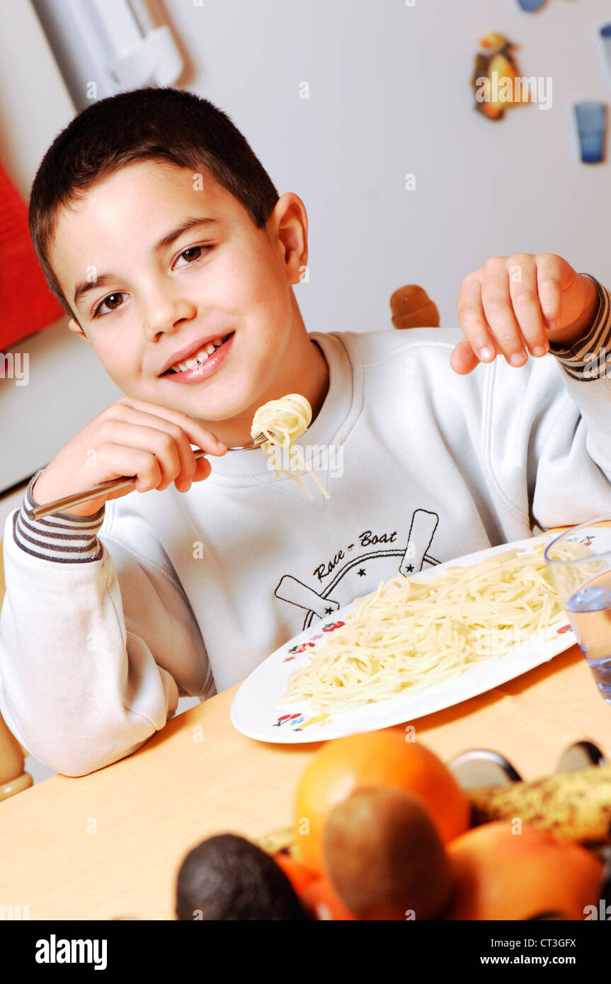CHILD EATING STARCHY FOOD Stock Photo - Alamy