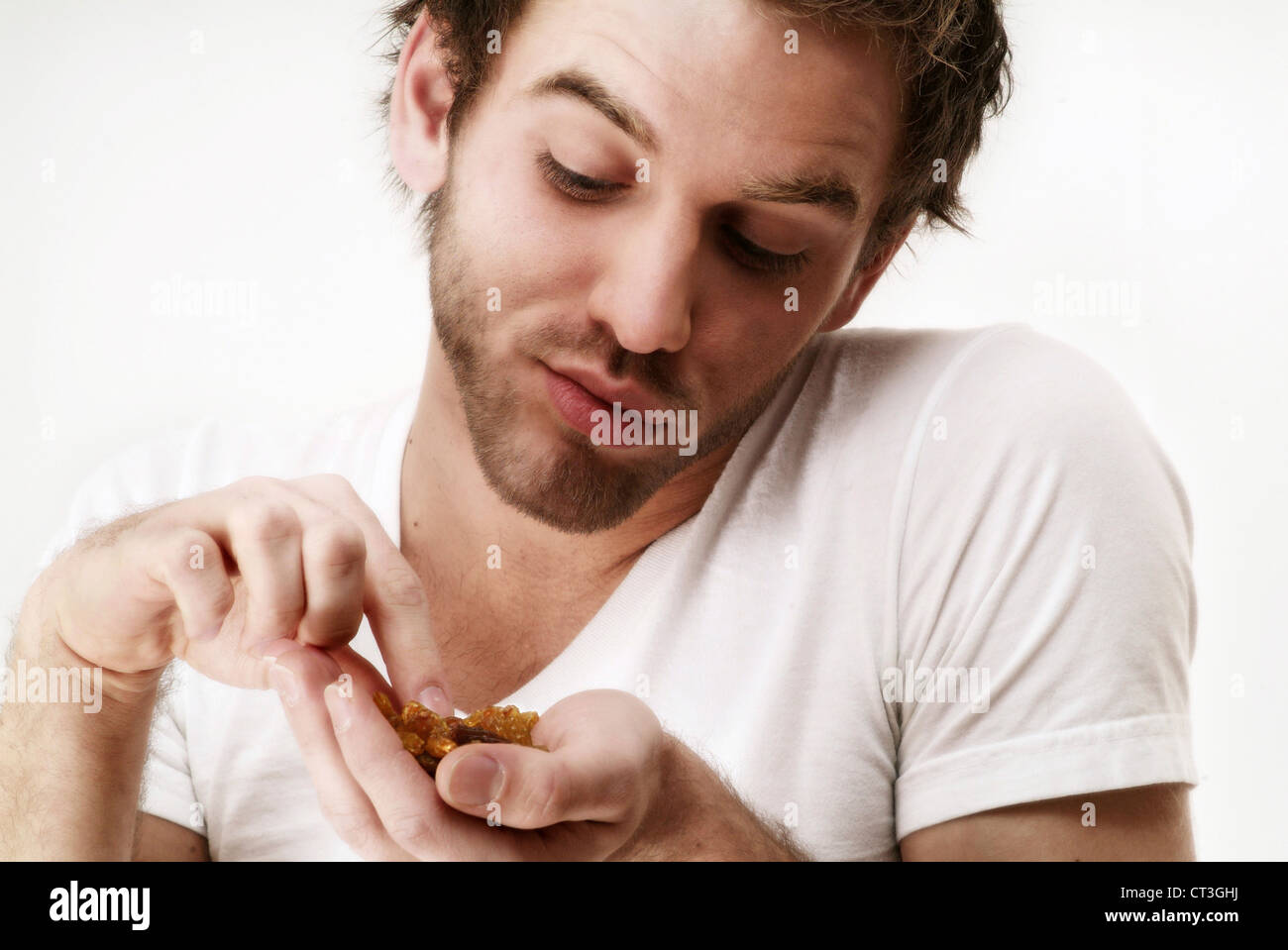 MAN EATING FRUIT Stock Photo - Alamy