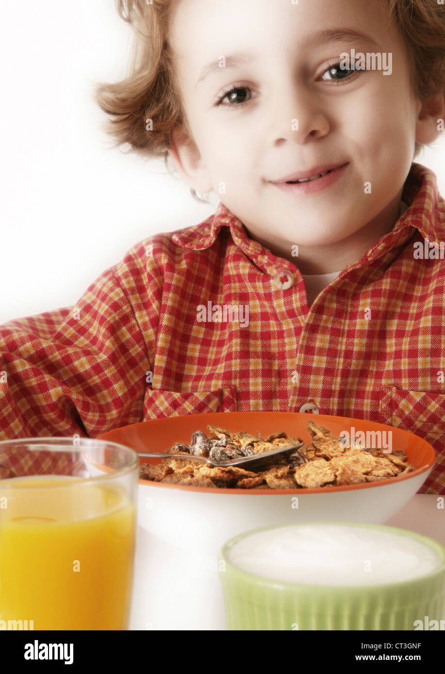 CHILD EATING BREAKFAST Stock Photo - Alamy