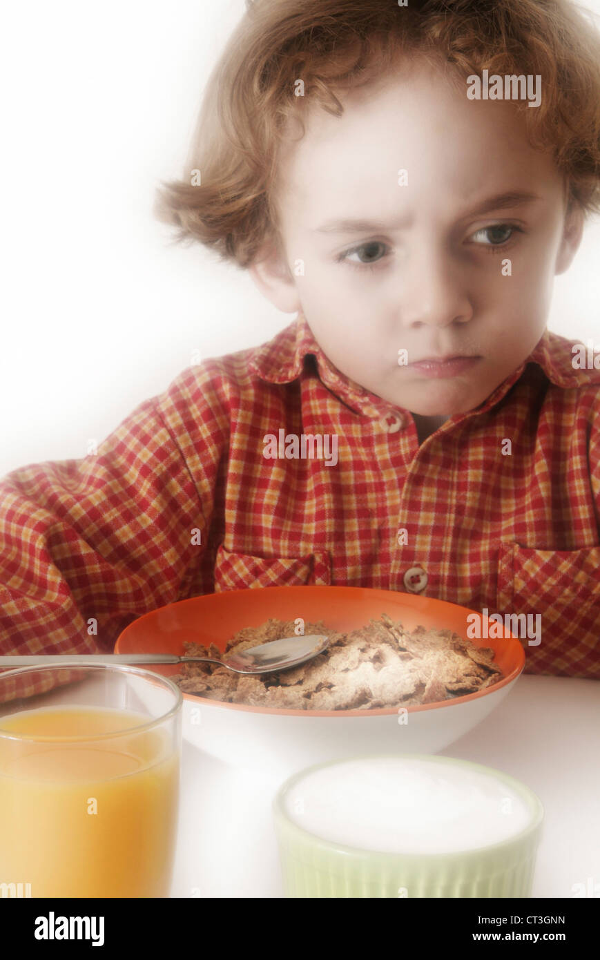 CHILD EATING BREAKFAST Stock Photo - Alamy