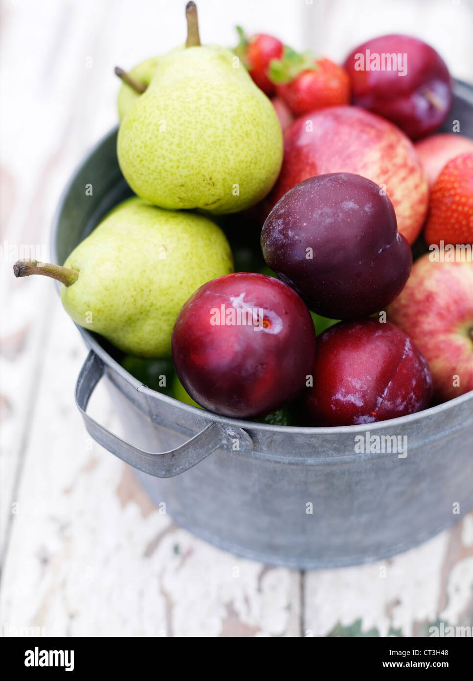 Close up of bucket of fruit Stock Photo - Alamy