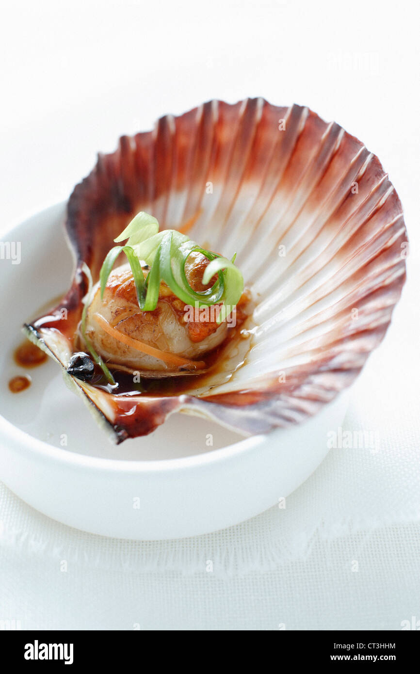 Close up of food served in shell Stock Photo - Alamy