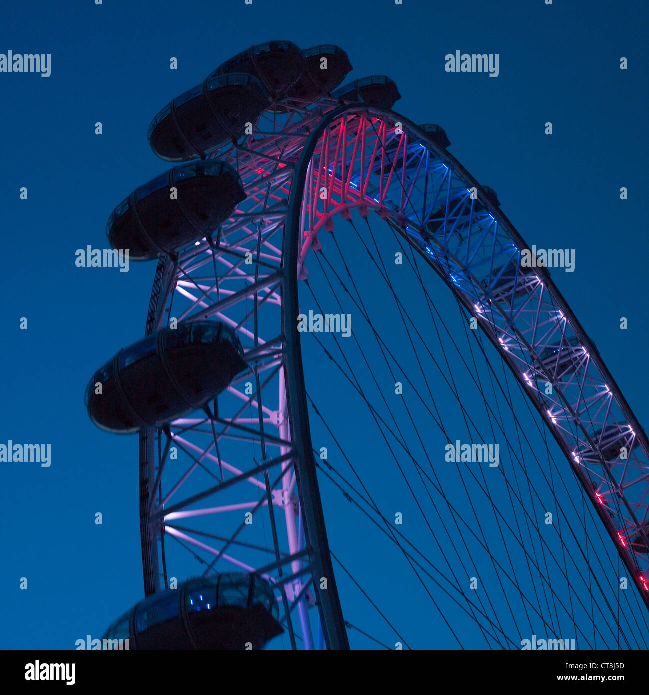 The iconic London Eye lit in red, white, and blue at night in central ...