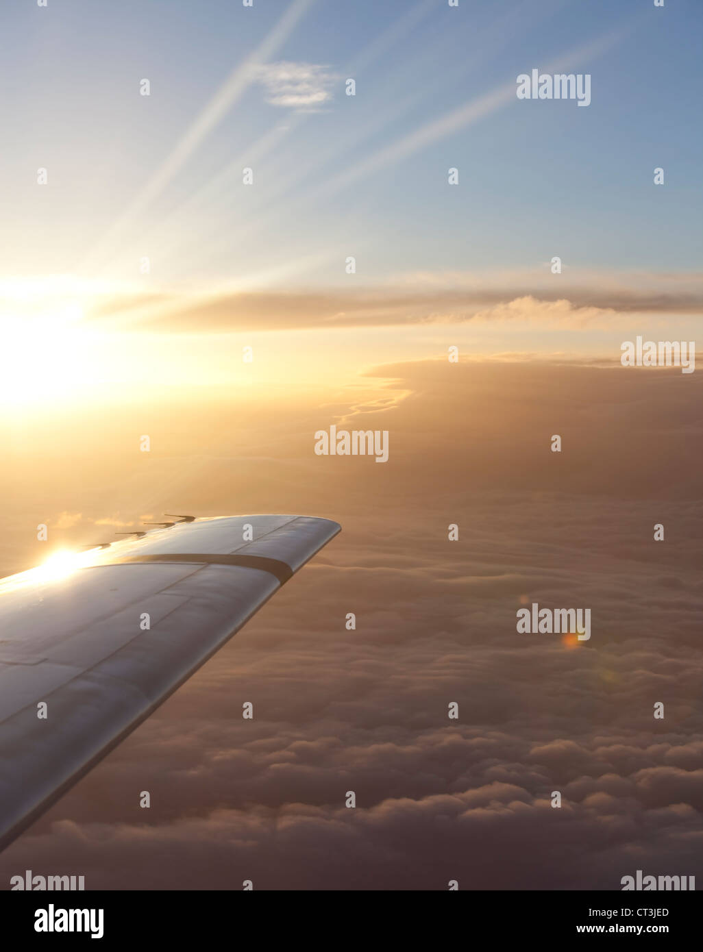 sunbeam above wing of an airplane with Romantic sky Stock Photo - Alamy