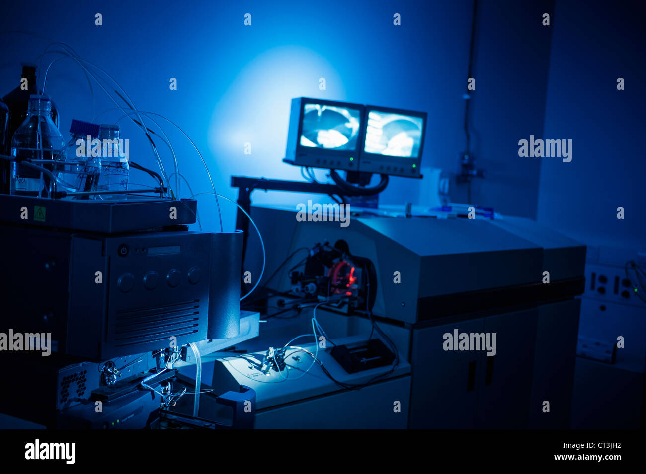 Machines glowing in lab Stock Photo - Alamy