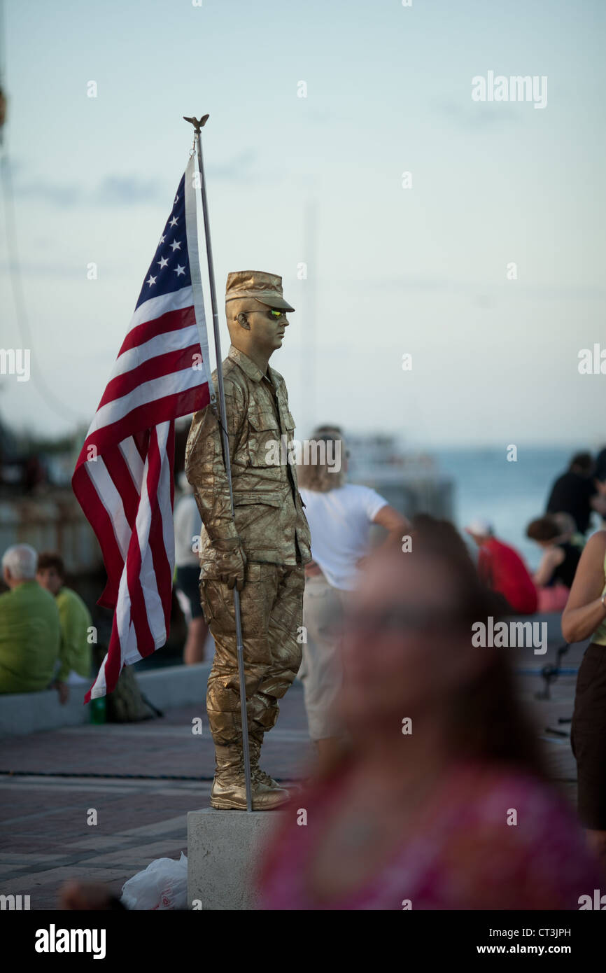A golden live statue of a US soldier with the USA flag in Mallory ...