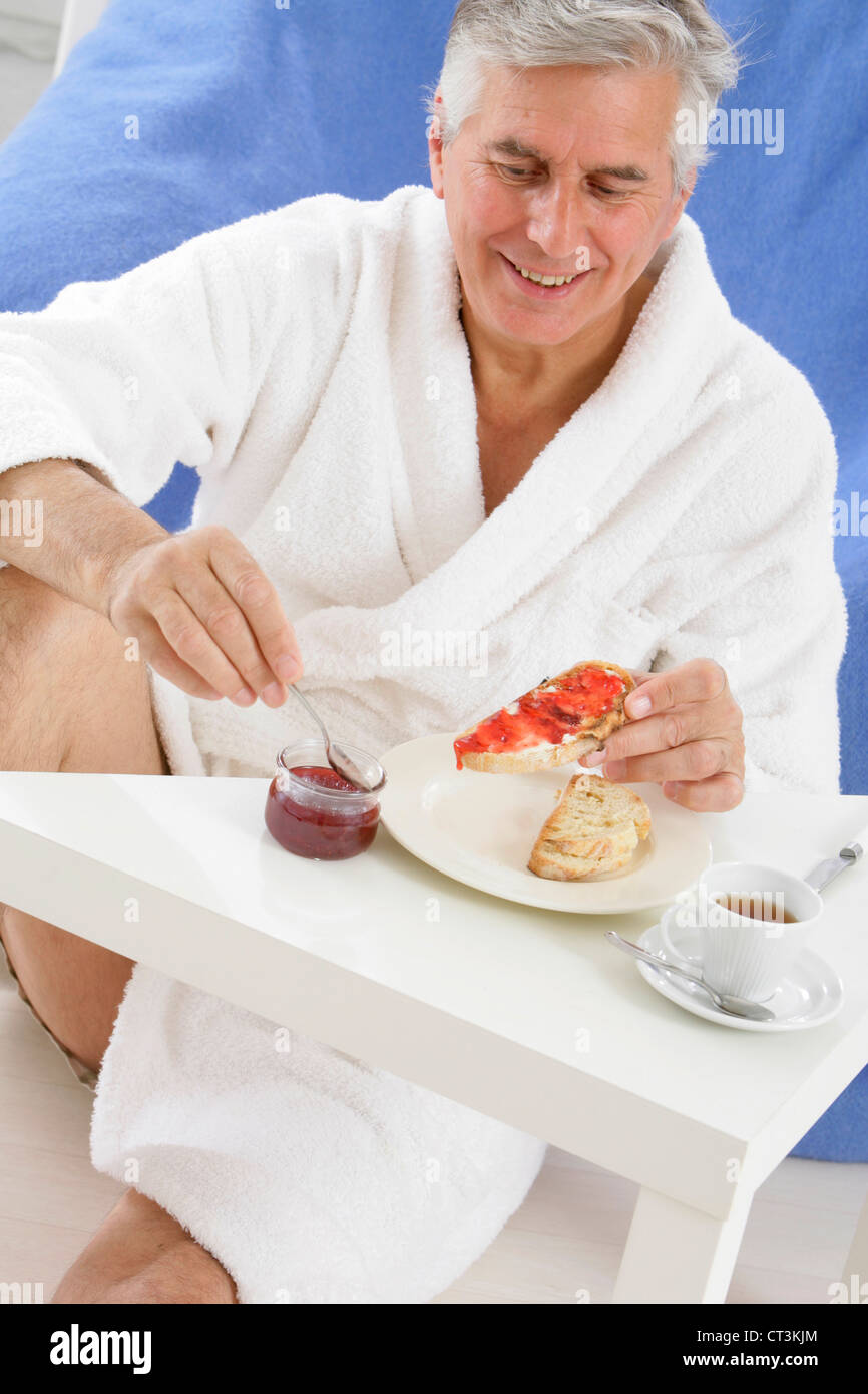ELDERLY PERSON EATING BREAKFAST Stock Photo - Alamy