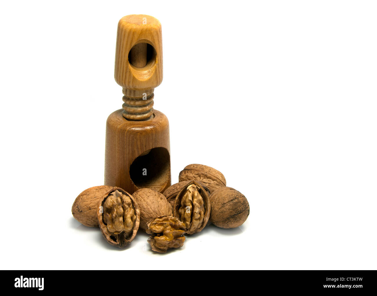 wooden nutcracker isolated on white with walnuts Stock Photo - Alamy