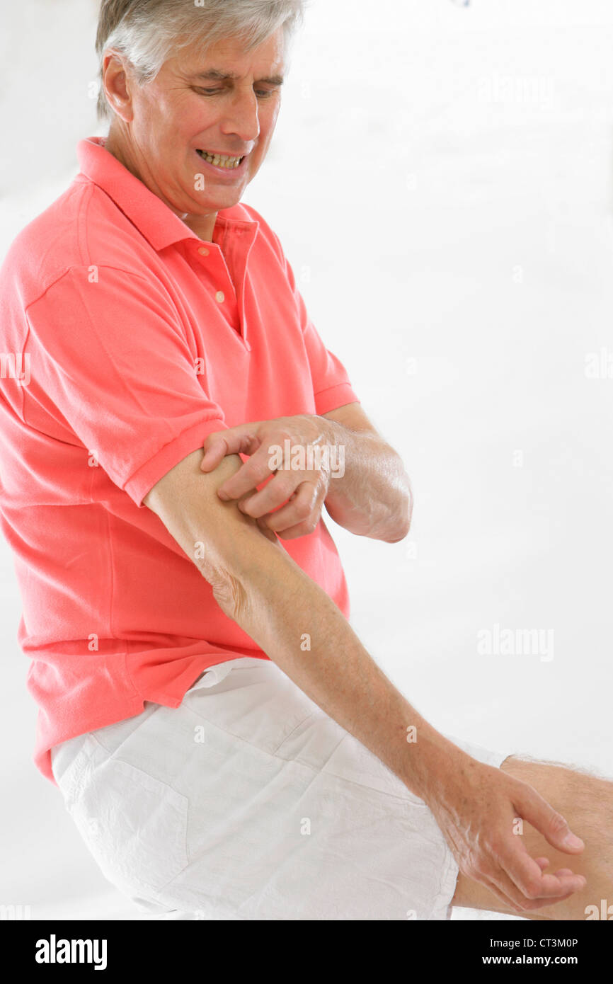 ITCHING IN AN ELDERLY PERSON Stock Photo - Alamy