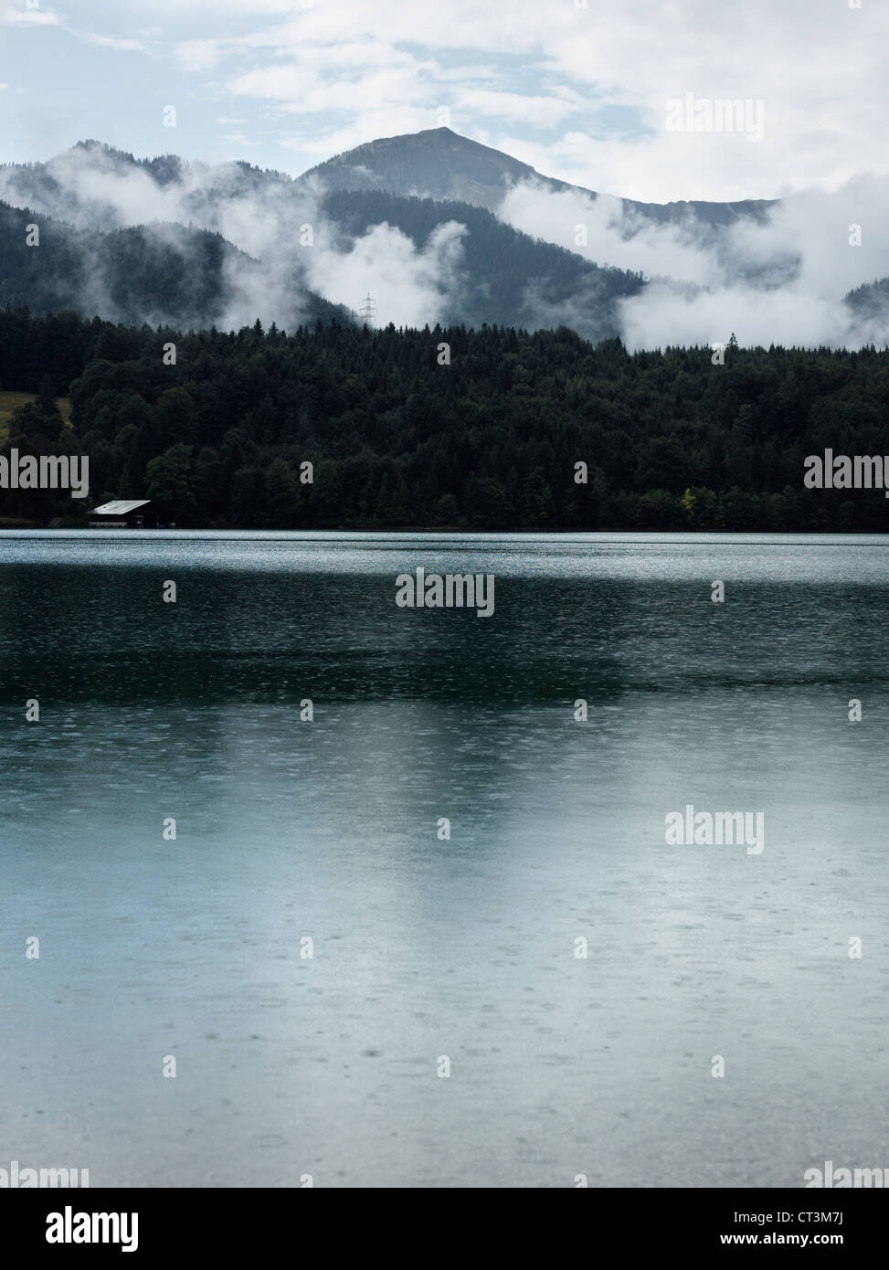 Fog over mountains and still lake Stock Photo - Alamy